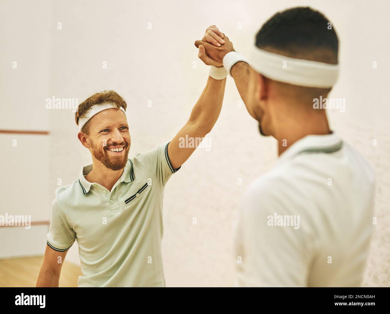 Real winners support each others success. two young men giving each ...