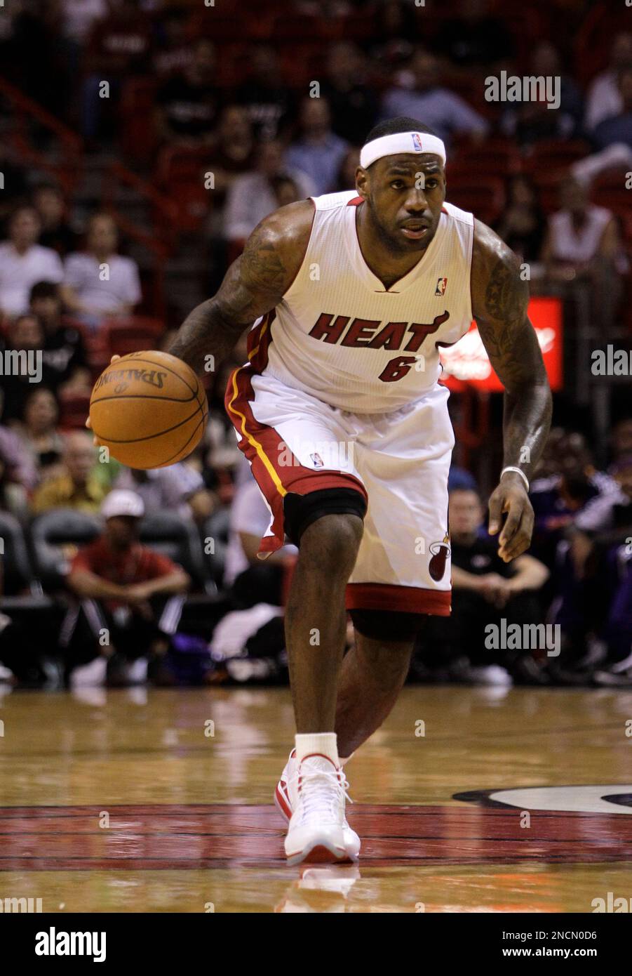 Miami Heat small forward LeBron James moves the ball down the court in ...
