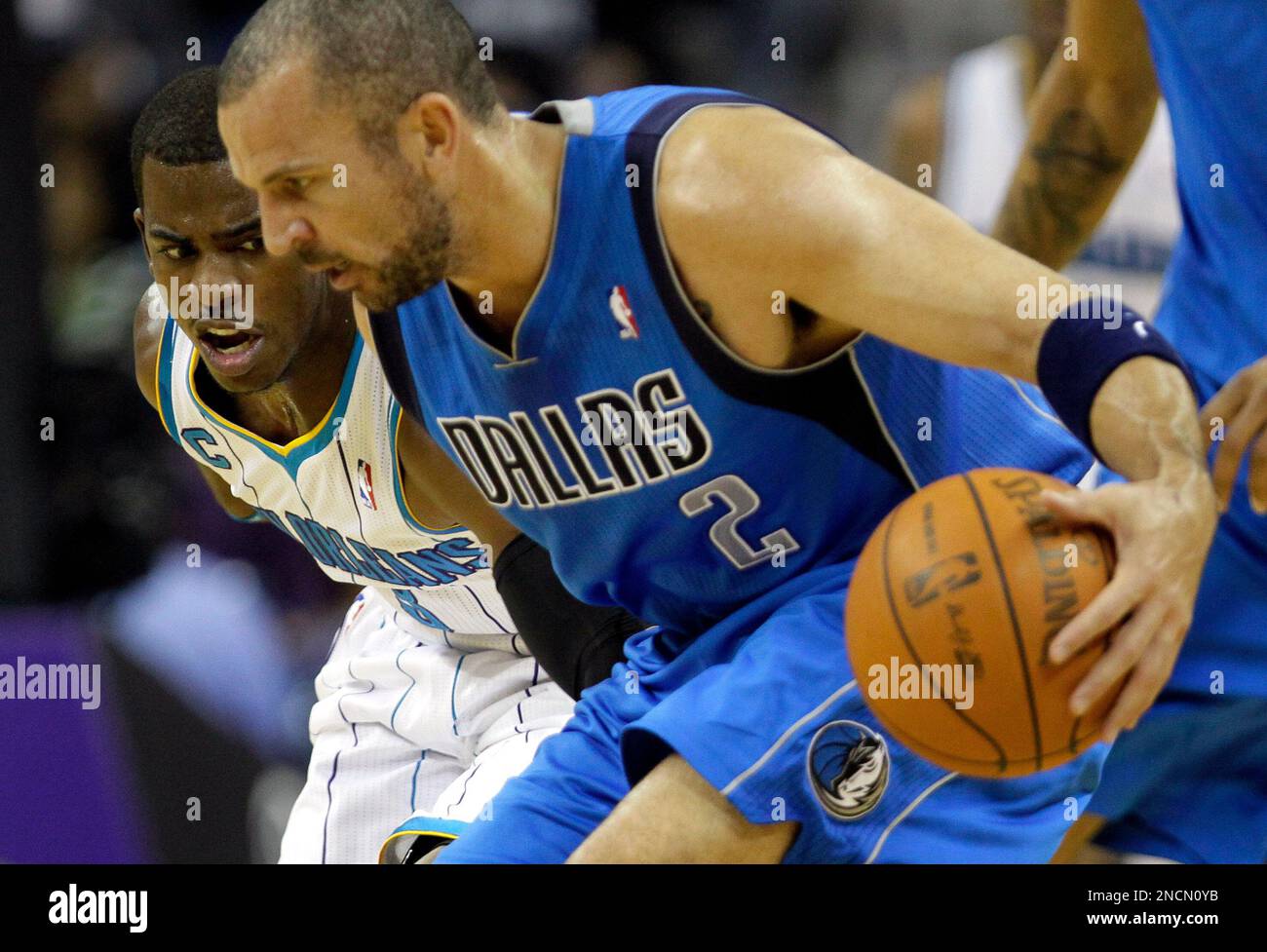 New Orleans Hornets point guard Chris Paul, background, guards Dallas ...
