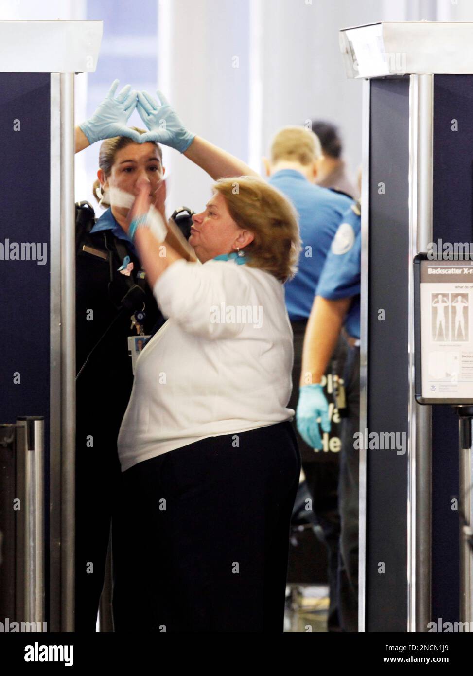 An airline passenger undergoes a full body scan at O'Hare International ...