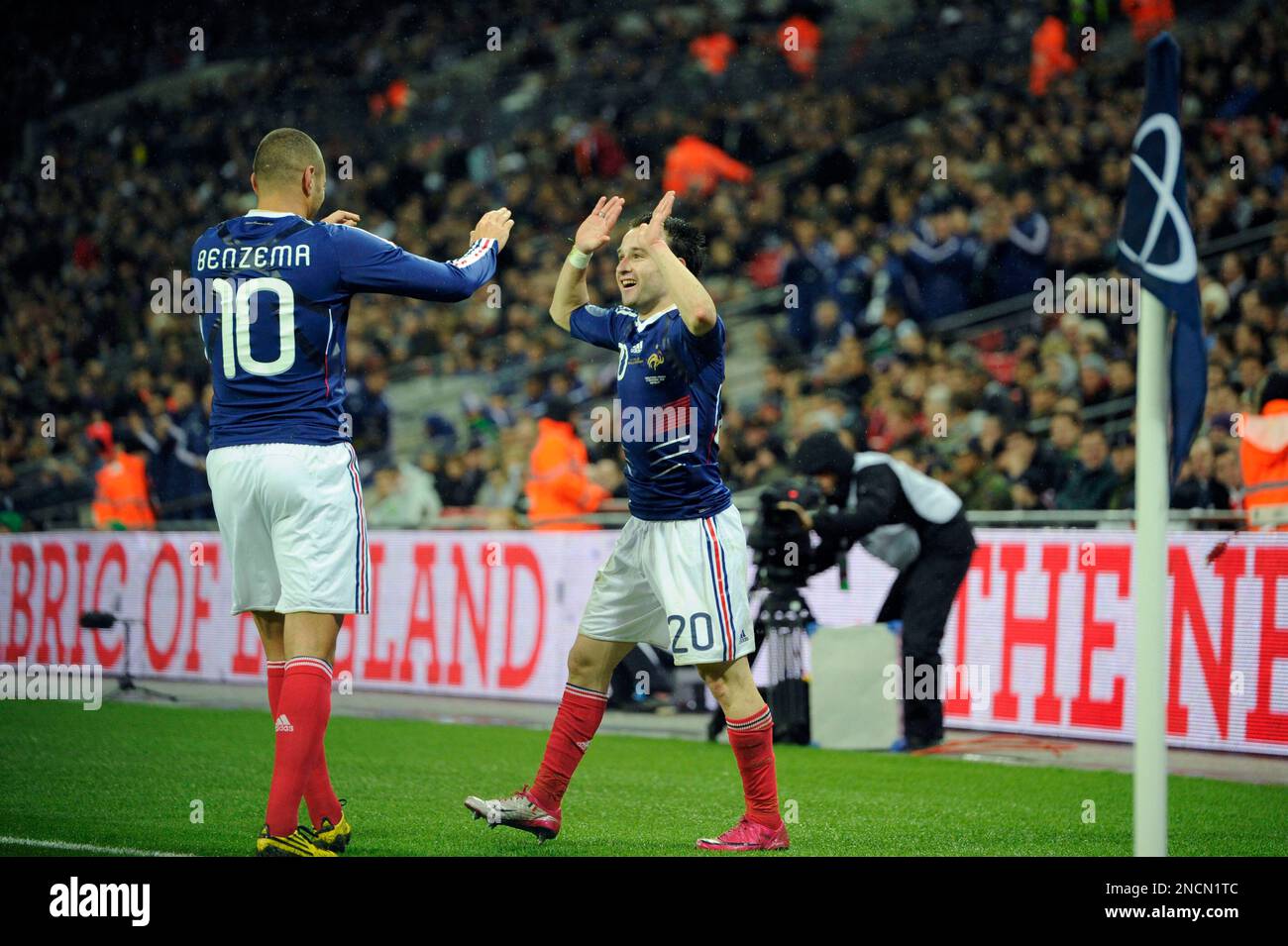 France's Mathieu Valbuena, right, celebrates his goal with his teammate ...