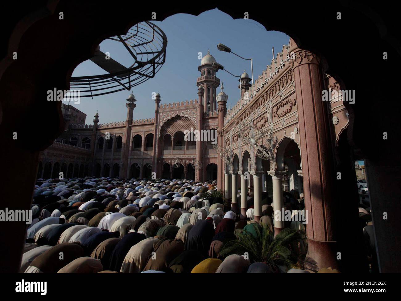 Pakistani Muslims offer Eid al Adha prayers at a central mosque in ...