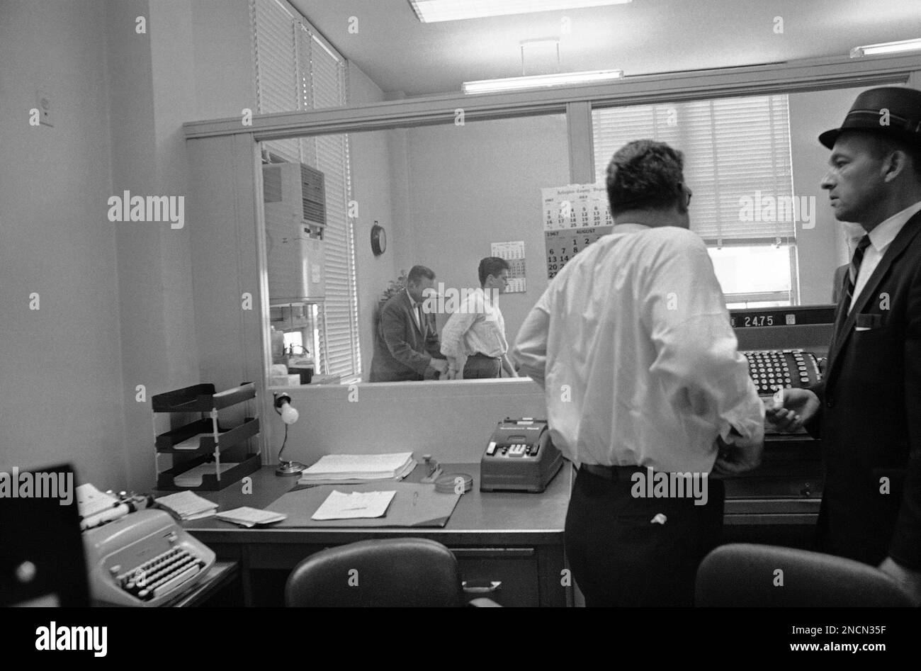 Detectives lead John Patler from Arlington, Va., police headquarters on ...