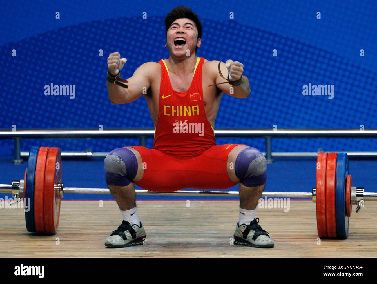 China's Lu Yong reacts after winning gold in the men's 85kg ...