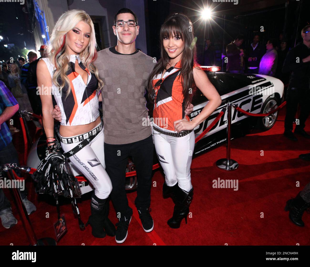 Anis Cheurfa, center, poses on the red carpet at the Electronic Arts ...