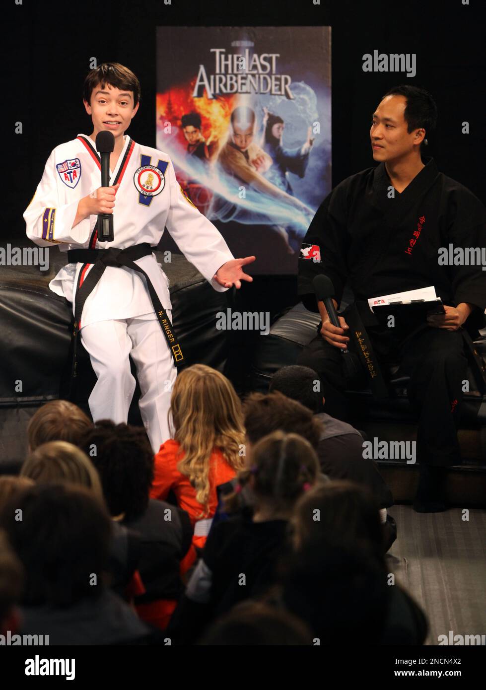Actor Noah Ringer, left, star of "The Last Airbender", speaks with ...