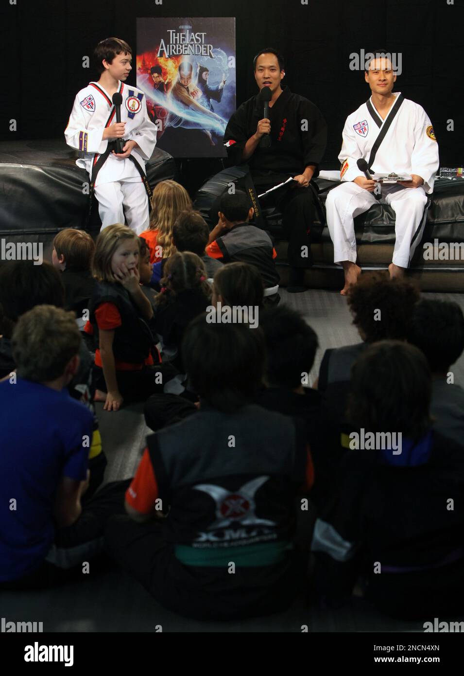Actor Noah Ringer, left, star of "The Last Airbender", speaks with ...