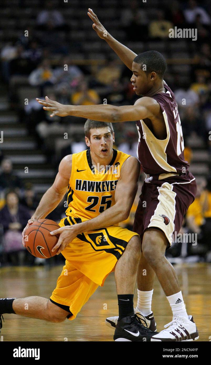 Iowa guard Eric May (25) looks to pass around Louisiana-Monroe's R.J ...