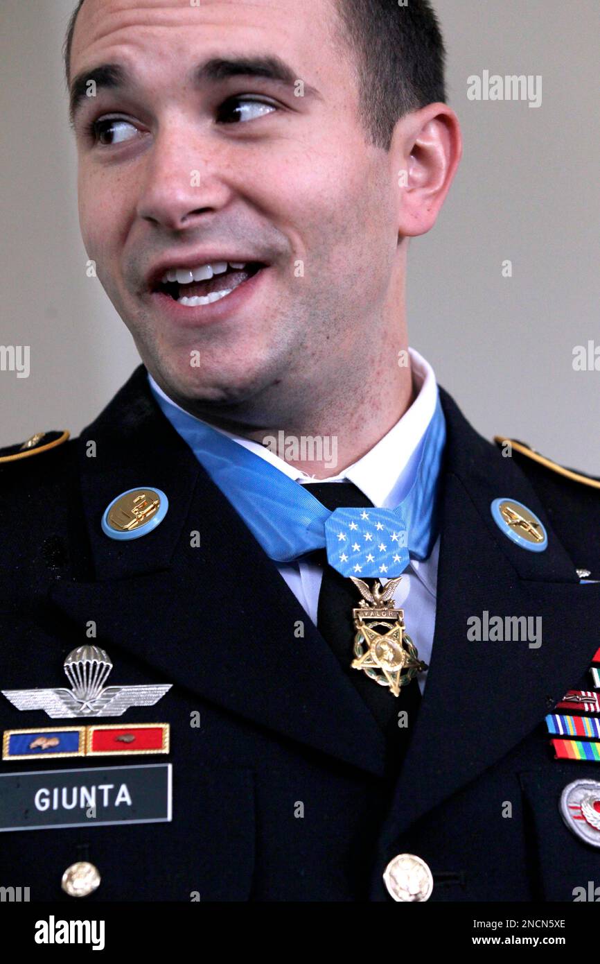 Staff Sgt. Salvatore Giunta smiles as he leaves the White House in ...