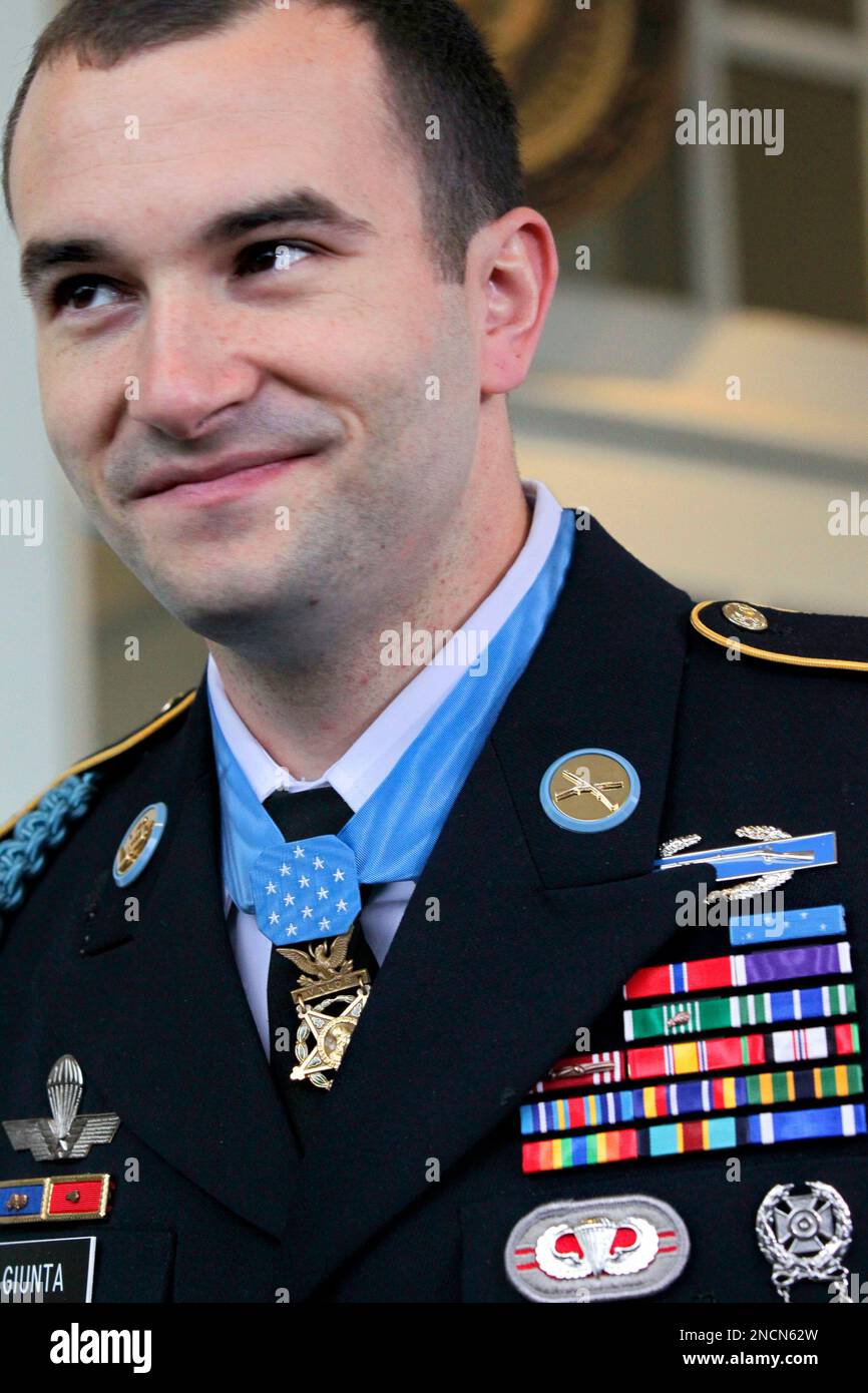 Staff Sgt. Salvatore Giunta smiles as he leaves the White House in ...