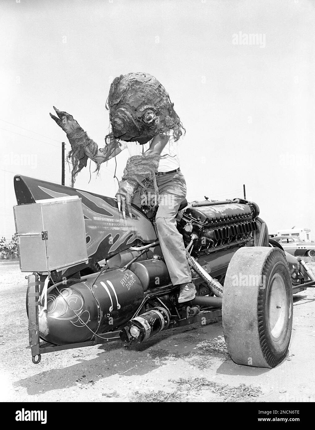 Art Arfons of Akron, Ohio, wears a monstrous outfit as he checks on new ...