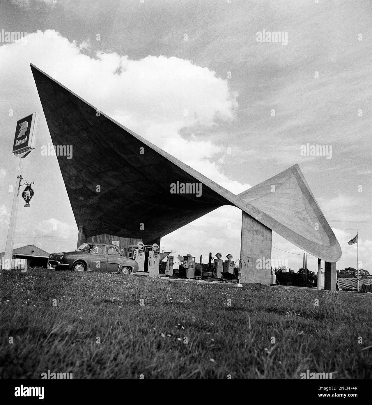 Pictured is a swooping roof design at a national service station in ...
