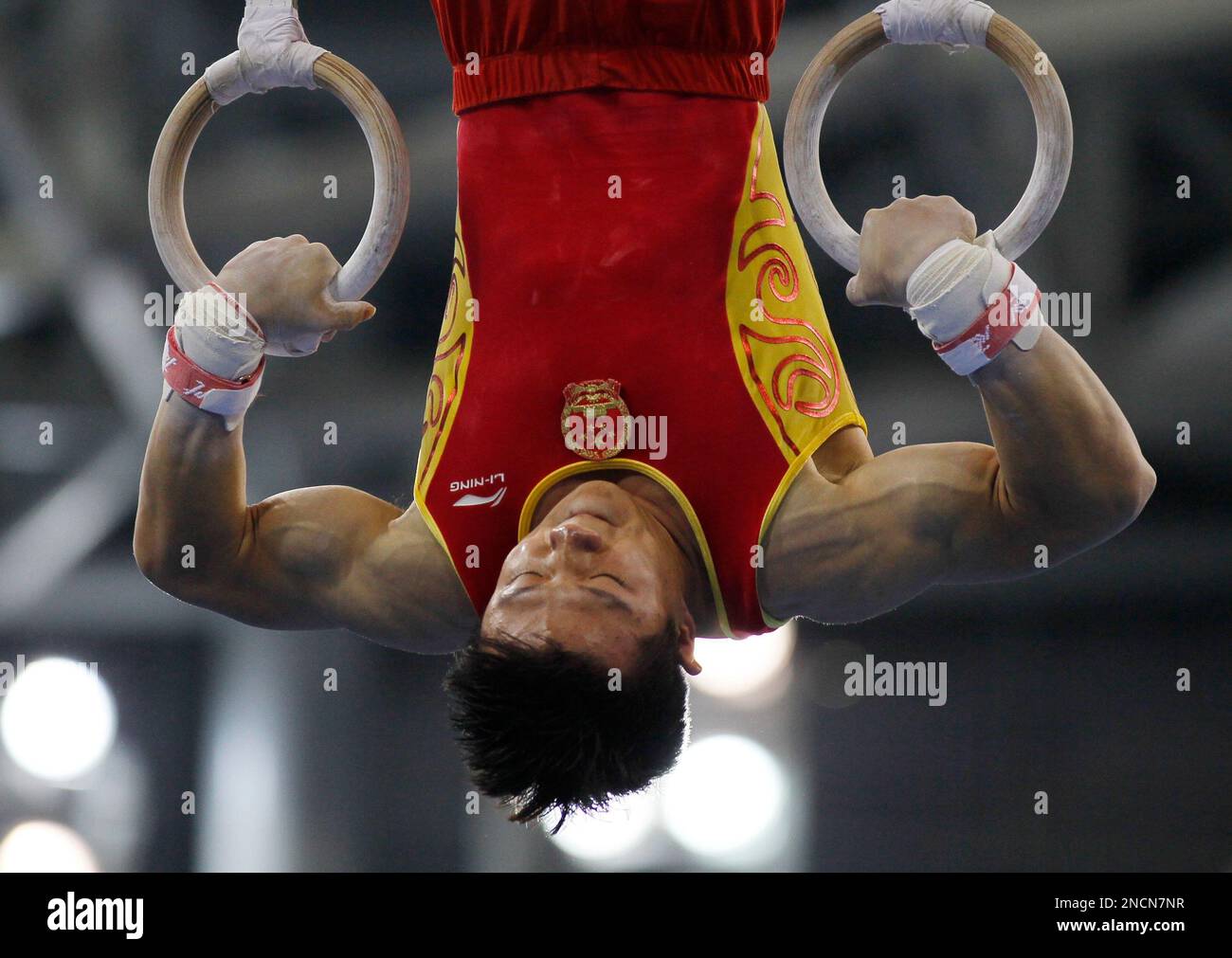 China's gymnast Chen Yibing performs his routine on the men's rings at ...
