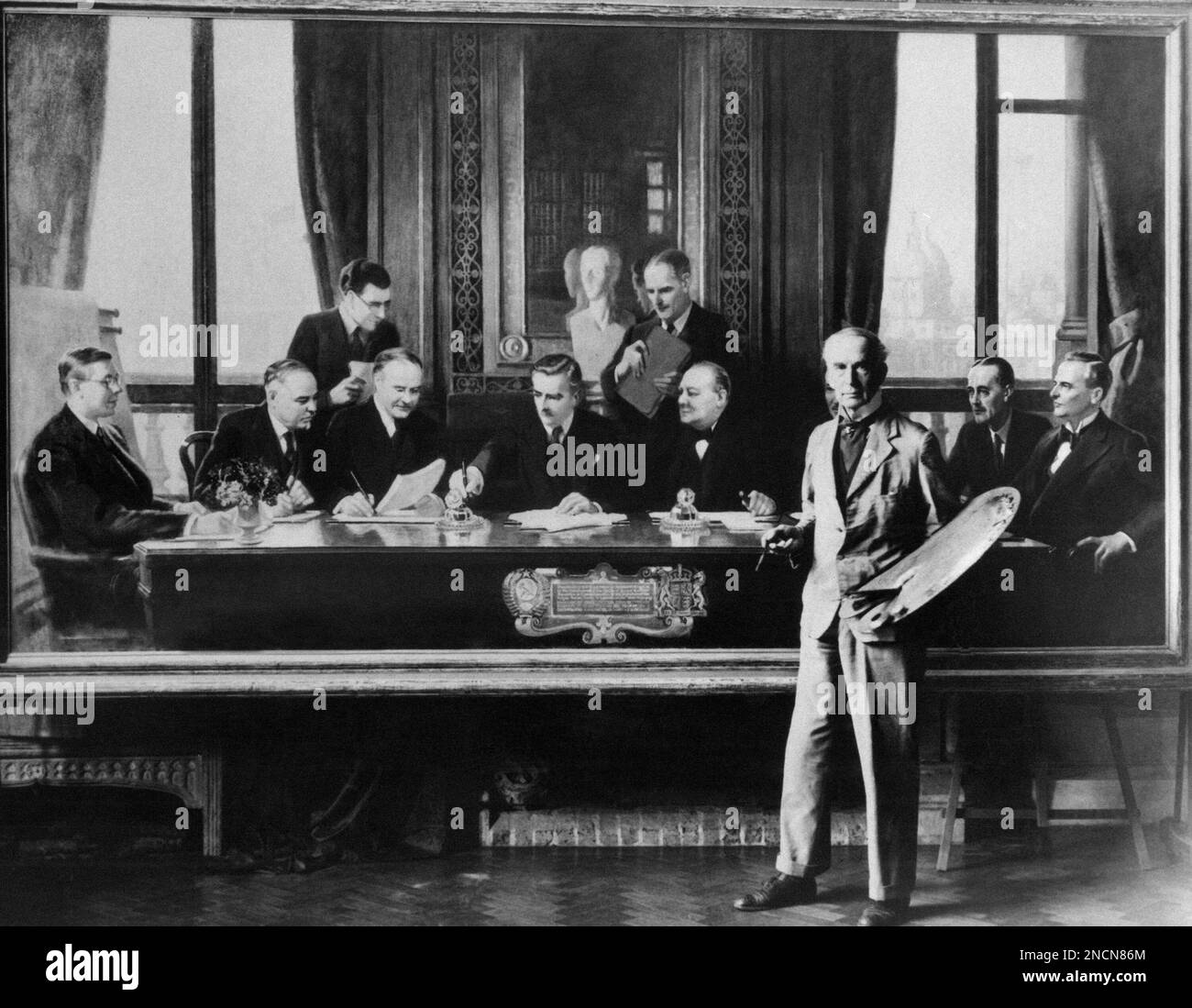 Frank O. Salisbury, English artist is seen standing before his painting ...