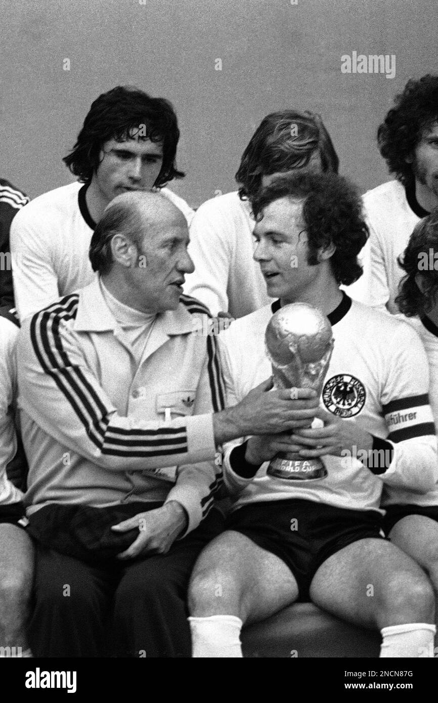 German national soccer team coach Helmut Schoen, left, holds the ...
