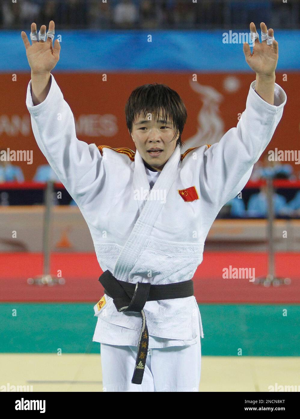 Wu Shugen of China reacts after winning against Tomoko Fukumi of Japan ...