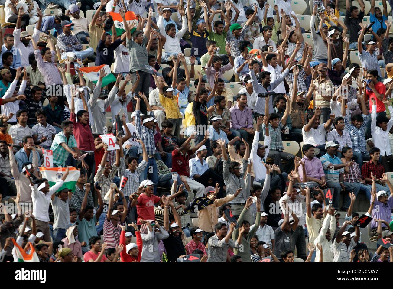 Indian cricket enthusiasts cheer for their home team during second ...