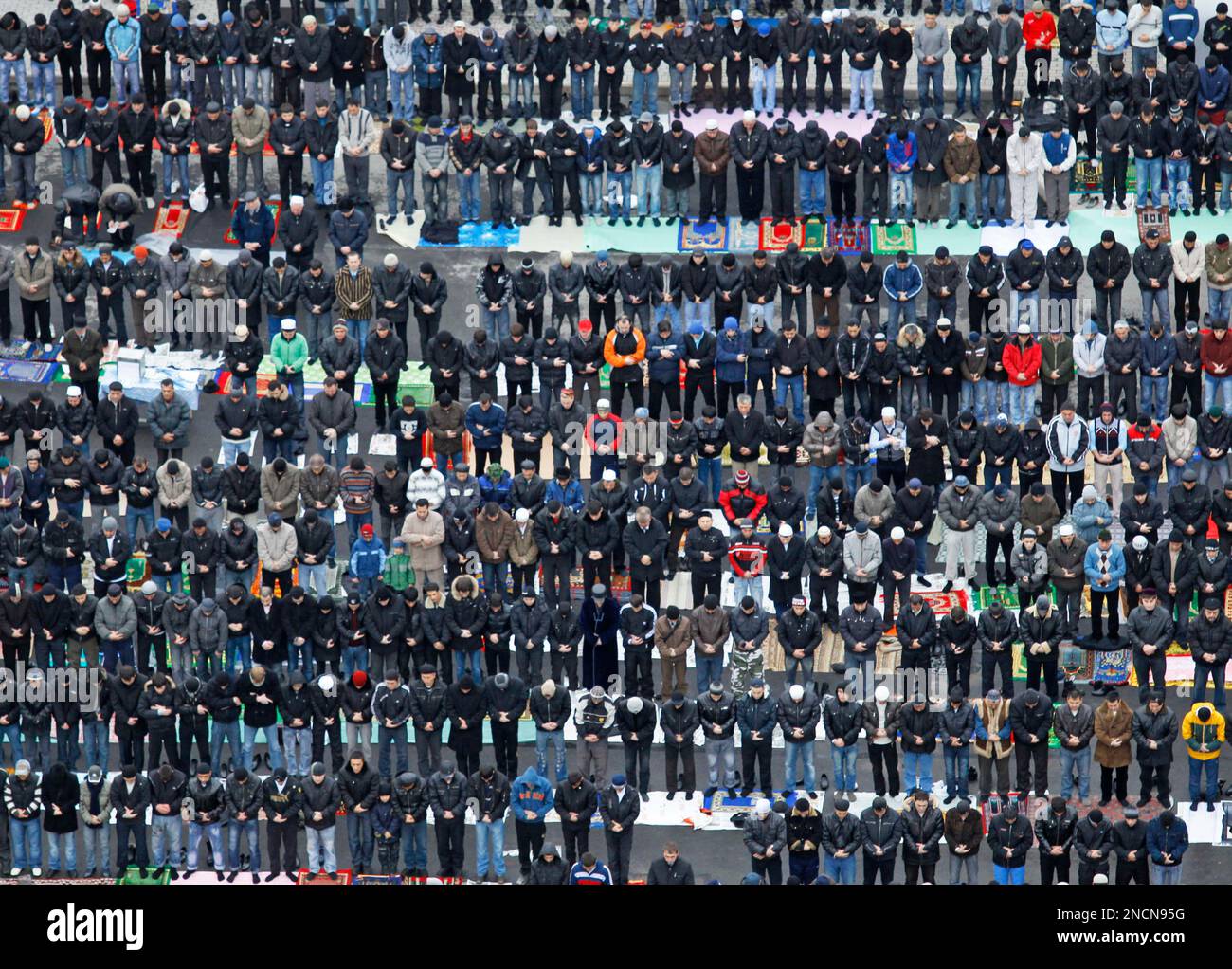 Russian Muslims pray outside a mosque in St. Petersburg, Russia, as ...