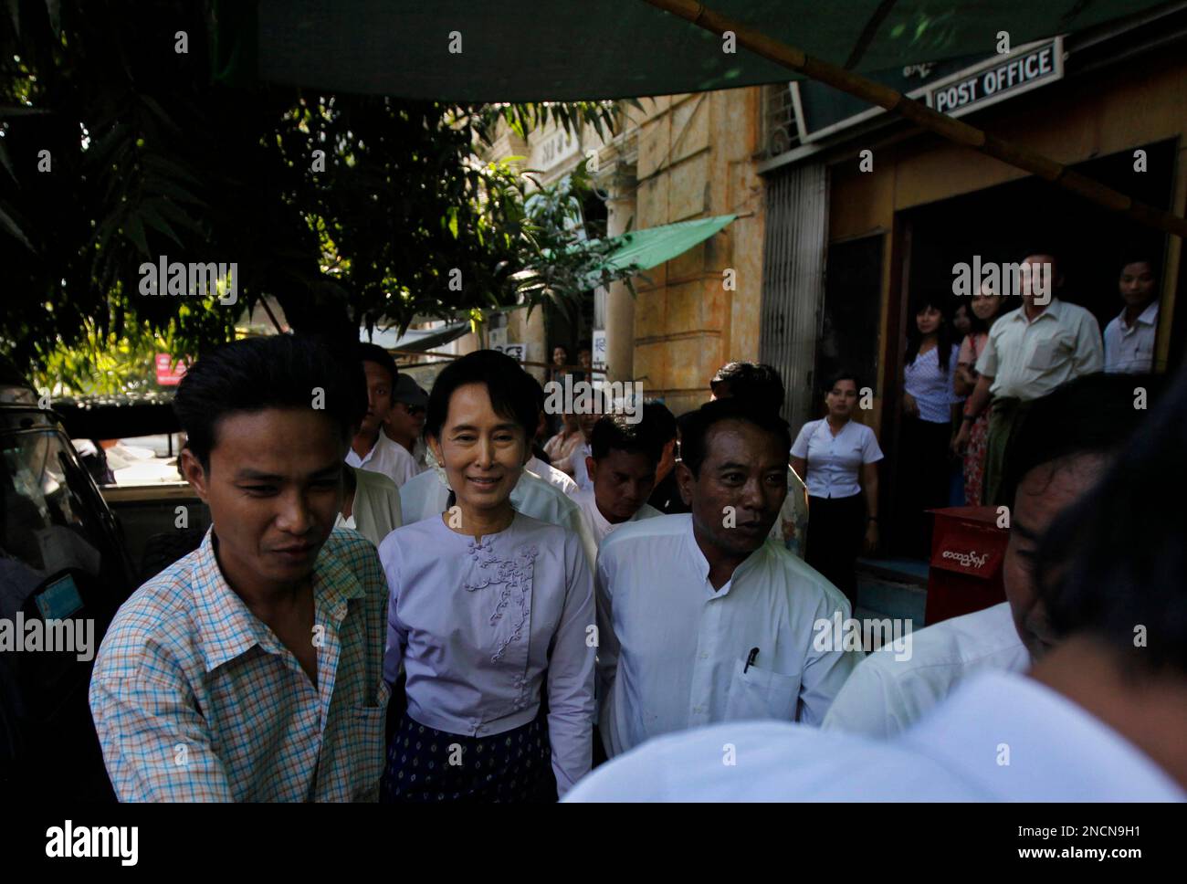 People gather to see Myanmar's pro-democracy leader Aung San Suu Kyi in ...