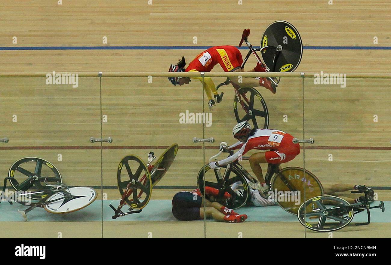 China's Tang Kerong, top, crashes as Japan's Mayuko Hagiwara, No 9 ...