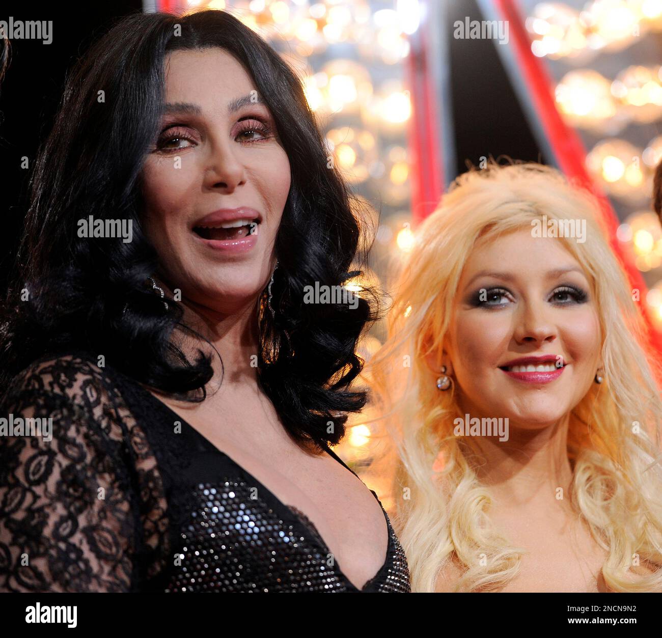 Cher, left, and Christina Aguilera, cast members in "Burlesque," pose ...