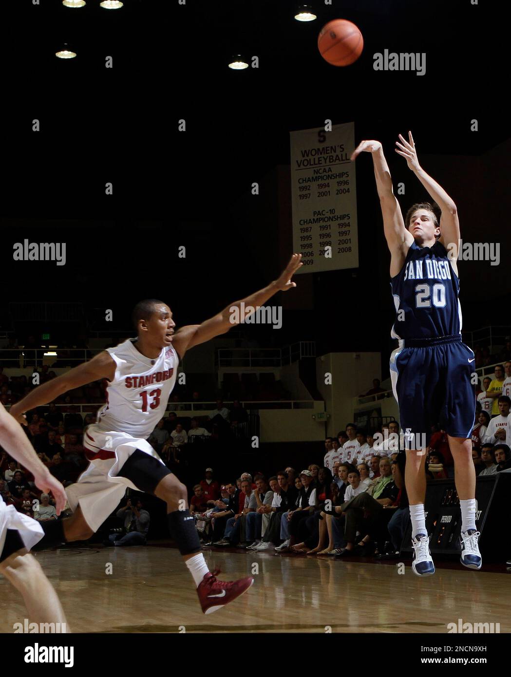 San Dieg guard Matt Dorr, right, shoots over Stanford's Josh Owens ...