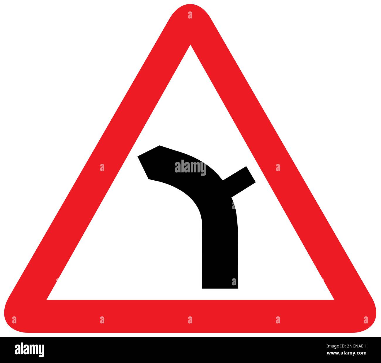 Junction on a bend ahead British road sign Stock Photo - Alamy