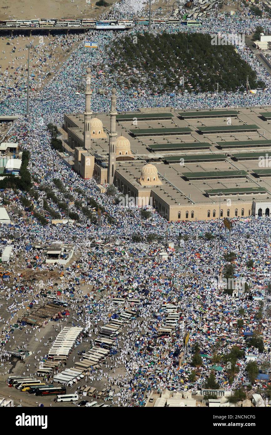 Muslim pilgrims pray outside Namira mosque in Arafat near Mecca, Saudi ...