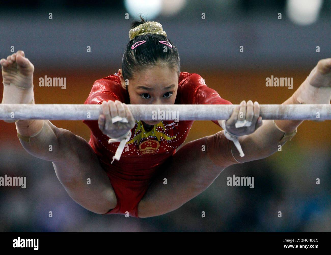 China's Sui Lu competes on the uneven bar during the gymnastics women's ...