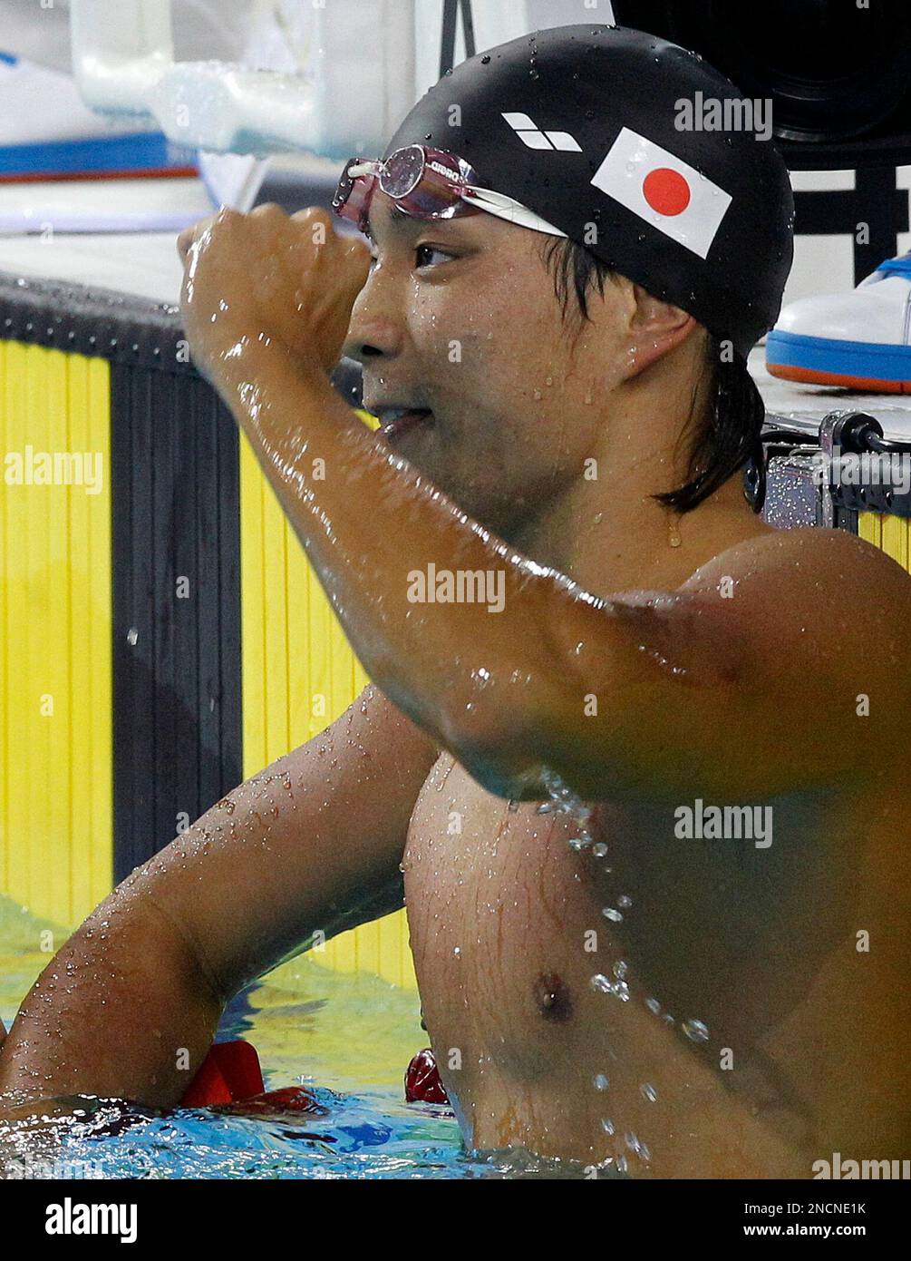 Japan's Ryo Tateishi reacts after winning the men's 100m Breaststroke final, at the 16th Asian ...