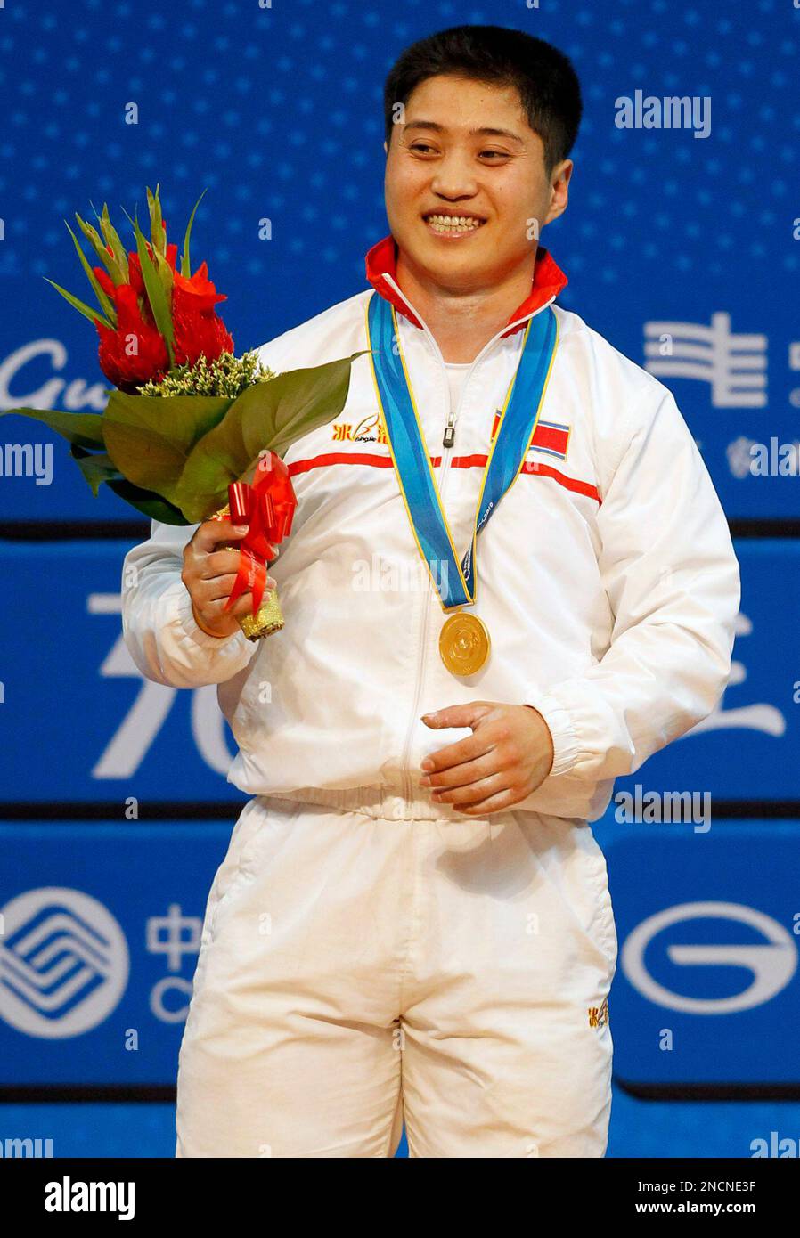 Kim Kum Sok of North Korea stands on the podium after winning the gold ...