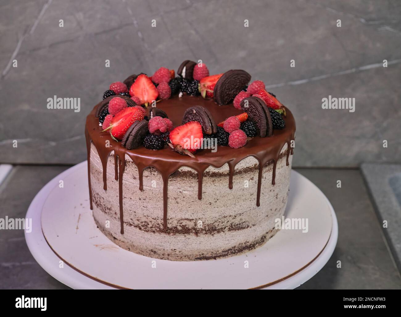 Fresh delicious homemade Chocolate cake strawberry and Oreo Stock Photo ...