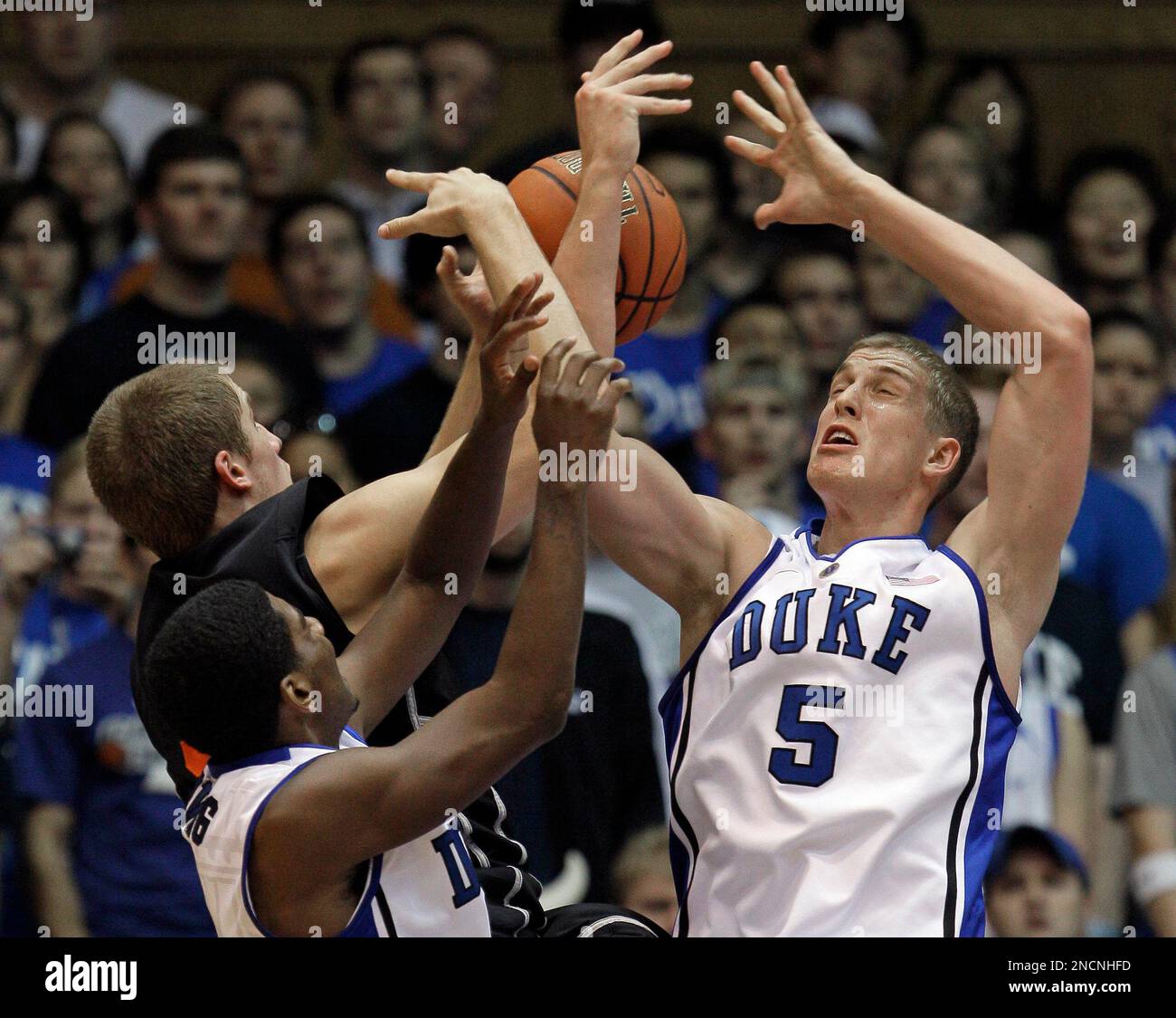 Duke's Mason Plumlee (5) and Kyrie Irving battle with Princeton's Ian ...