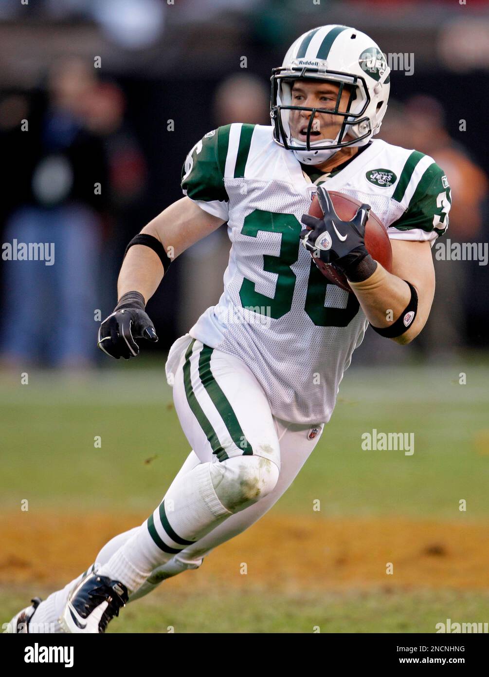 New York Jets safety Jim Leonhard runs the ball in an NFL football game ...