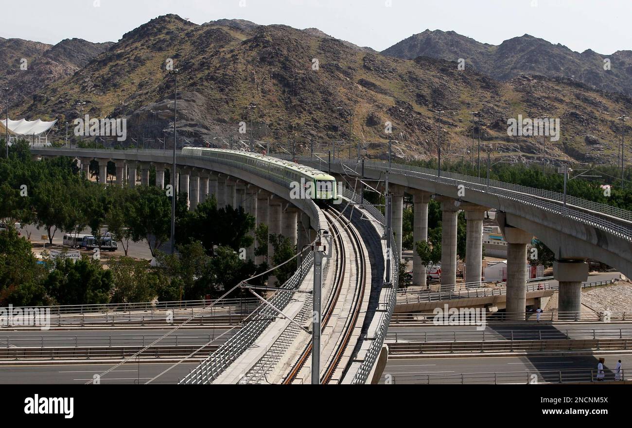 A Mecca Metro train arrives at a station during a testing period in ...