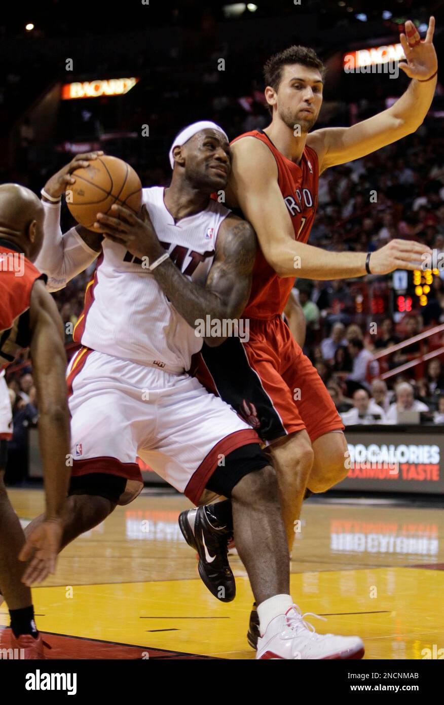 Miami Heat's LeBron James goes to the basket as Toronto Raptos' Andrea ...