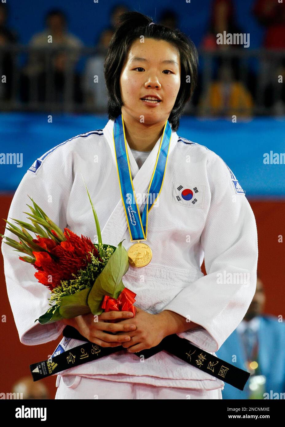 South Korea's Hwang Ye Sul poses for photos with her gold medal at the women's judo -70kg medal ...