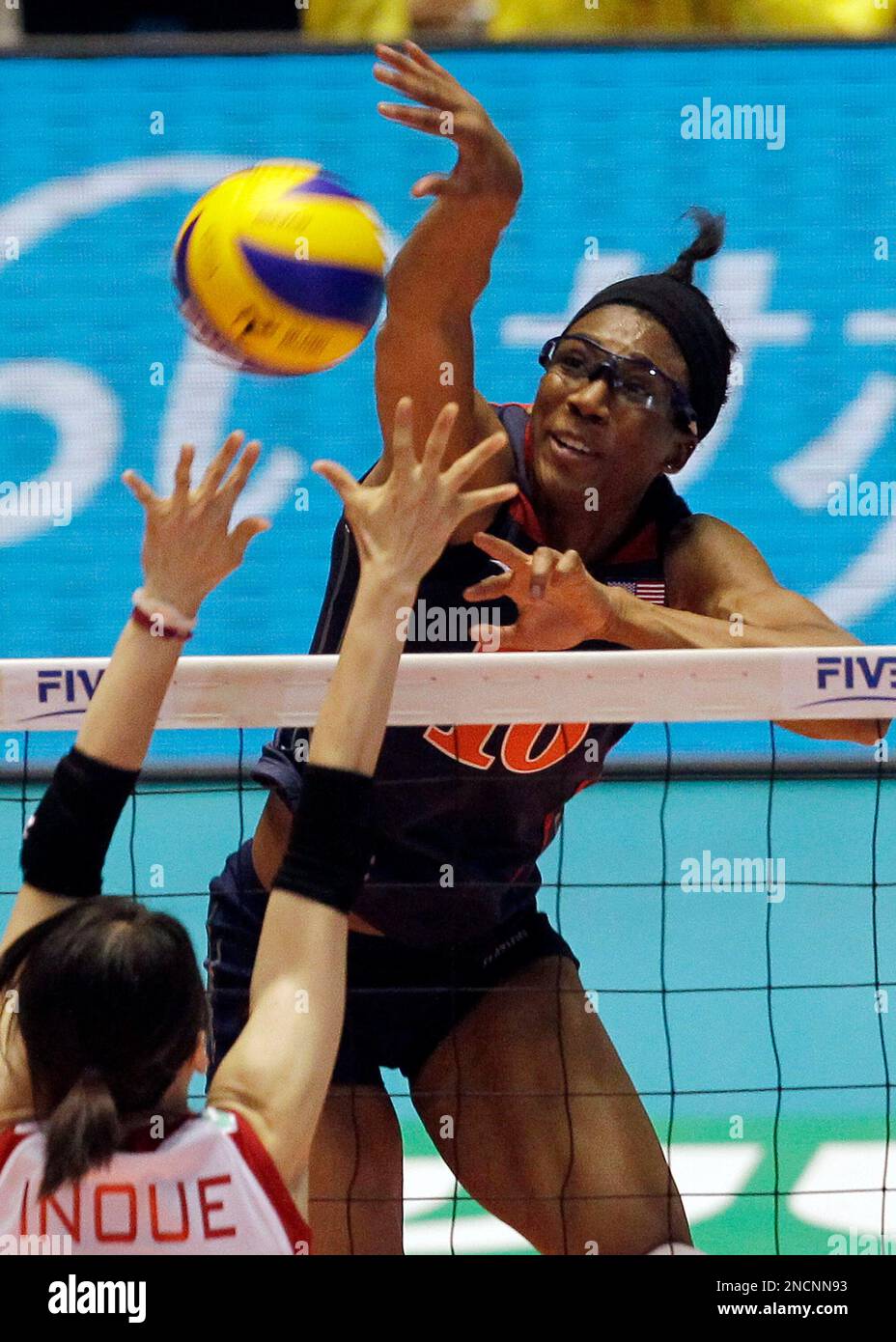 Foluke Akinradewo of the United states spikes the ball against Kaori ...