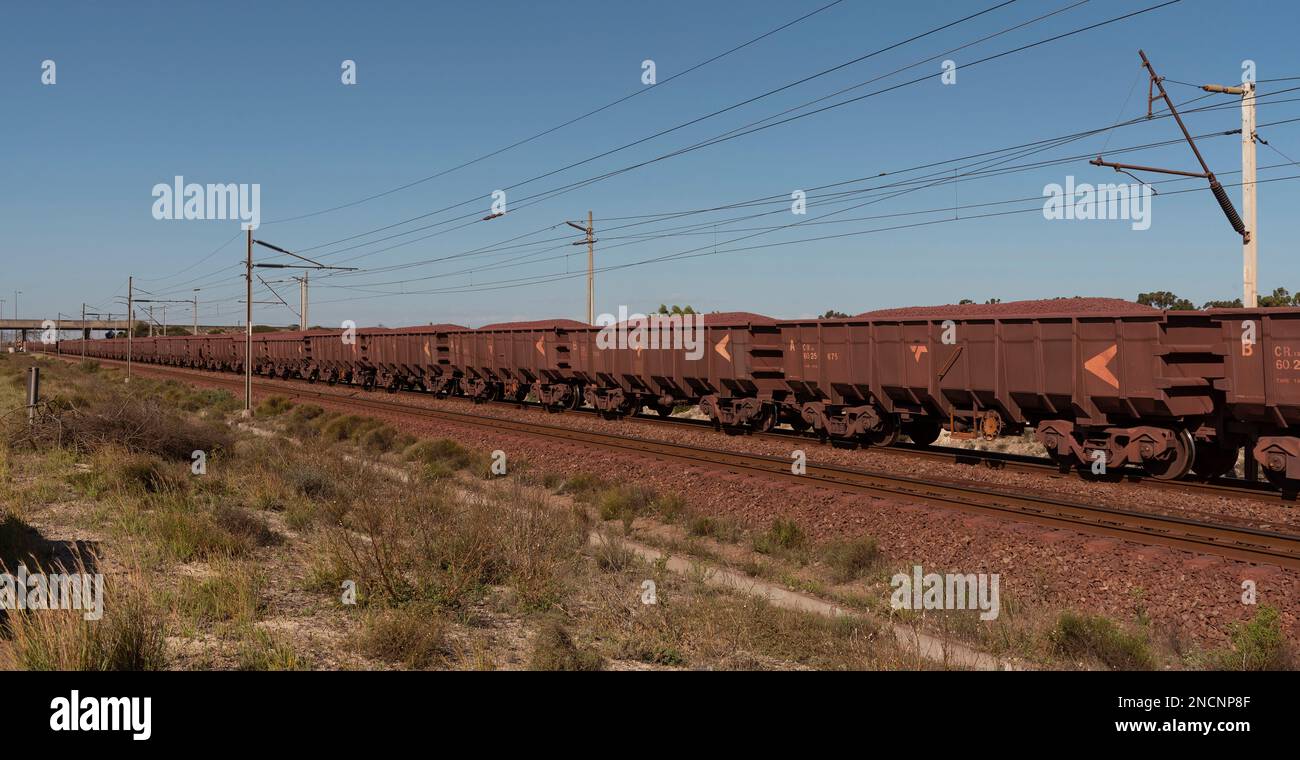 Saldanha Bay, west coast, South Africa. 2023. Railway wagons carrying ...