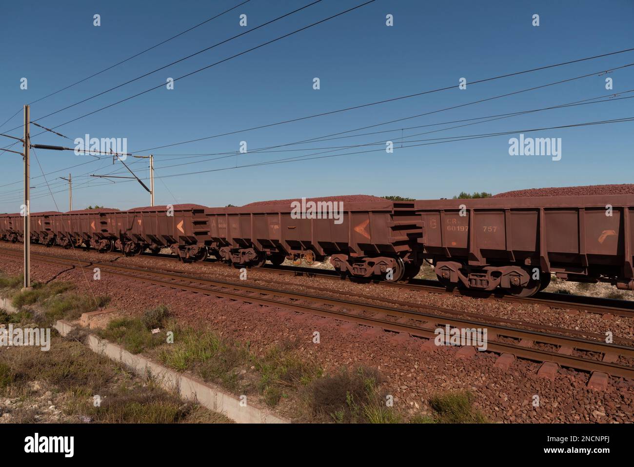 Saldanha Bay, west coast, South Africa. 2023. Railway wagons carrying ...