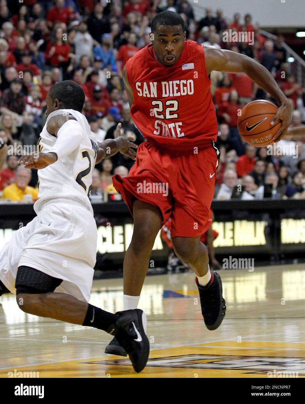 San Diego State guard Chase Tapley, right, drives around Long Beach ...