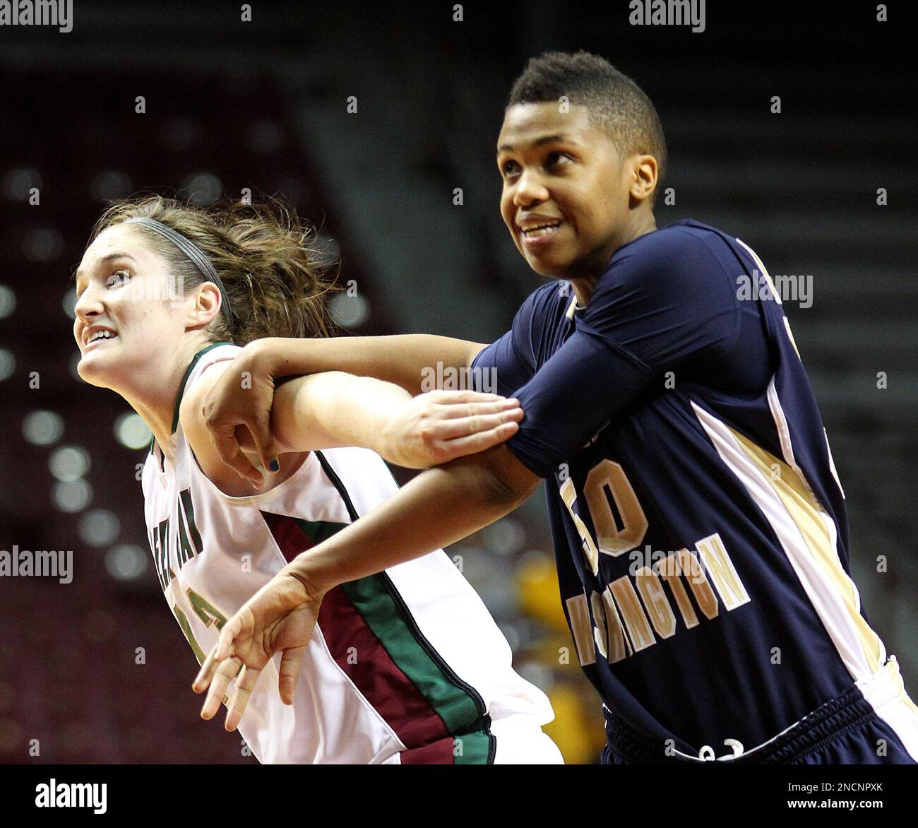 George Washington basketball player Kye Allums, right, battles for a ...