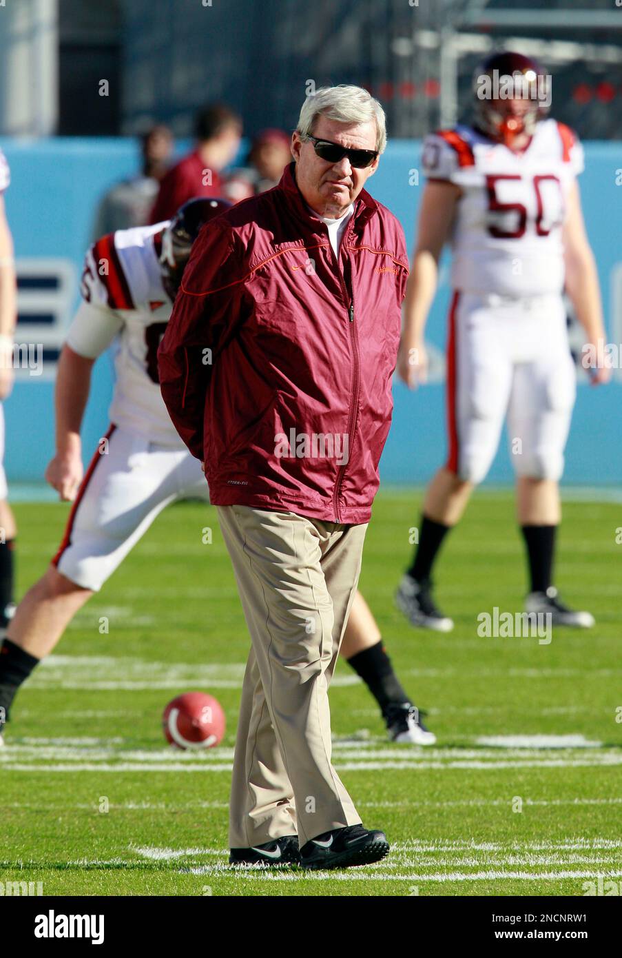 Virginia Tech coach Frank Beamer watches his team warm up prior an NCAA ...