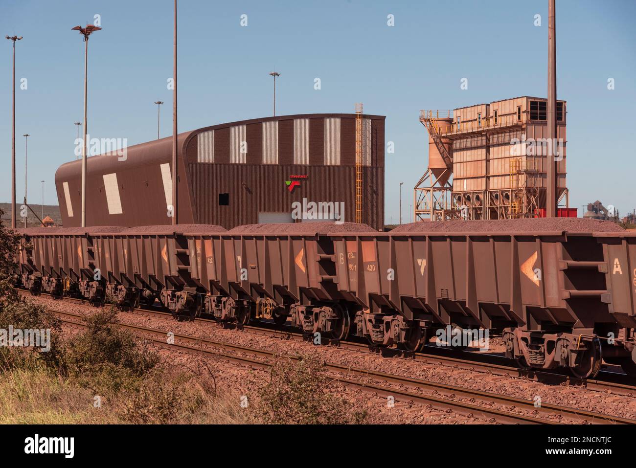 Saldanha Bay, west coast, South Africa. 2023. Railway wagons carrying ...