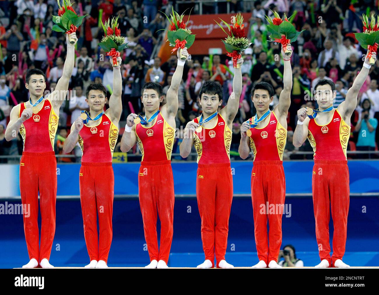 China's men's gymnastics team from left to right, Zhang Chenglong, Chen ...