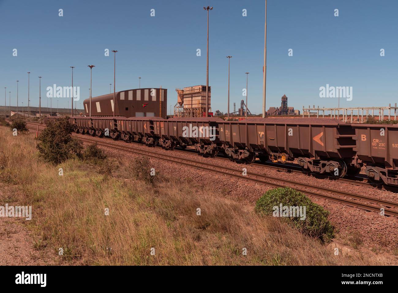 Saldanha Bay, west coast, South Africa. 2023. Railway wagons carrying ...