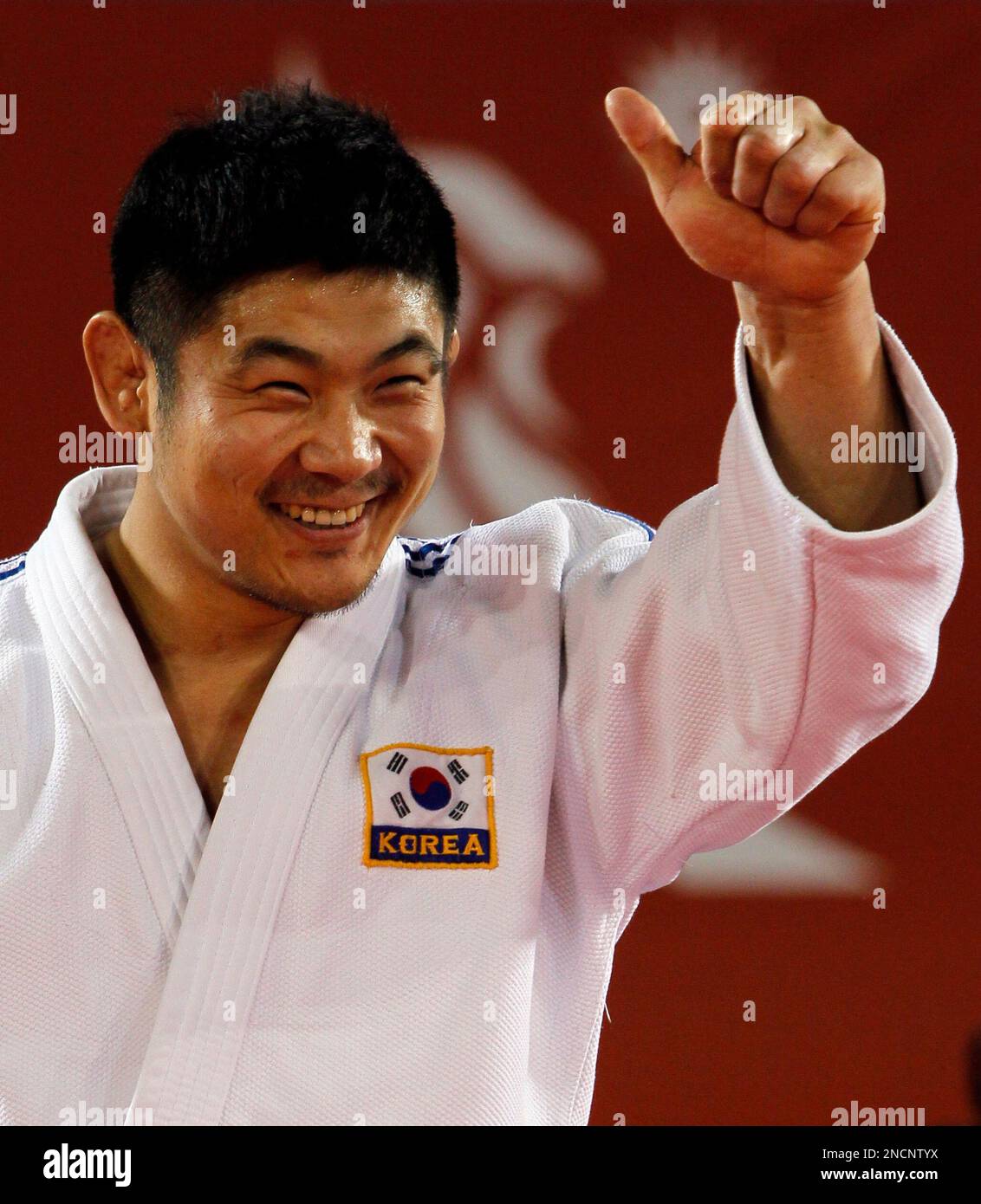South Korea's Hwang Hee Tae, gives a thumb up as he attends the medal ...