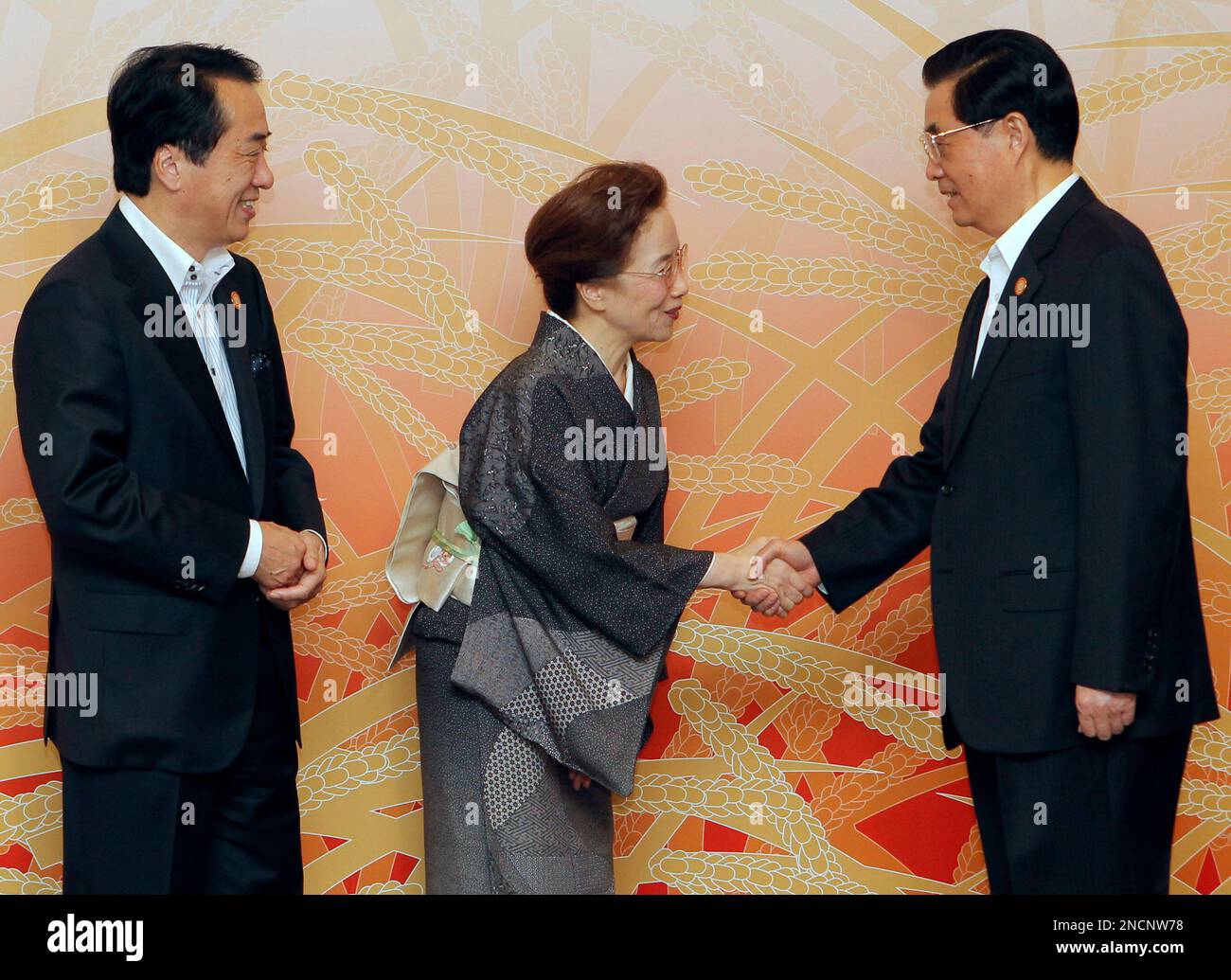 Chinese President Hu Jintao, right, is welcomed by Japanese Prime ...