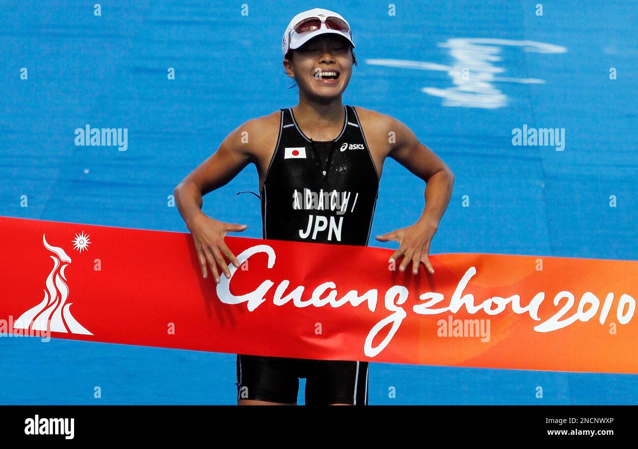 Japan's Mariko Adachi celebrates as she crosses the finish line to win ...