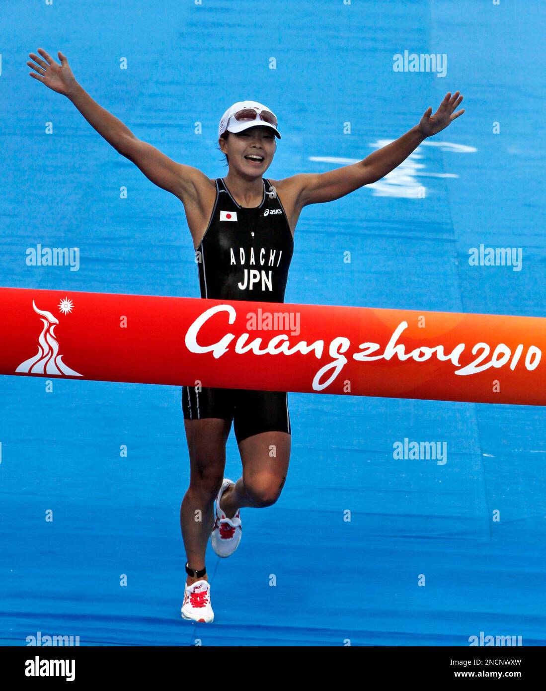 Japan's Mariko Adachi celebrates as she crosses the finish line to win ...